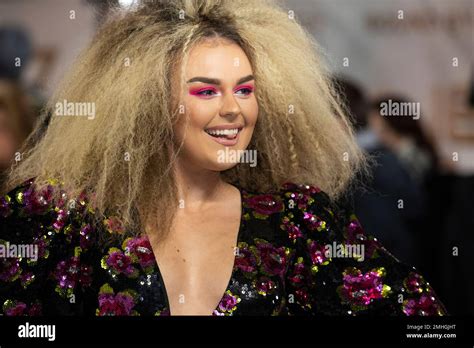 Tallia Storm Poses For Photographers Upon Arrival At The Premiere Of