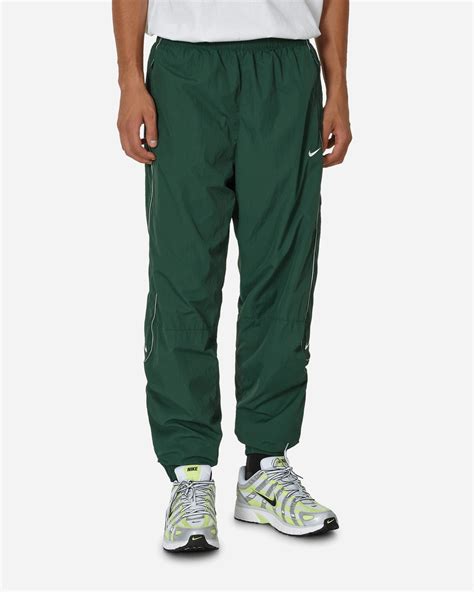 Nike Solo Swoosh Woven Track Pants Fir In Green For Men Lyst
