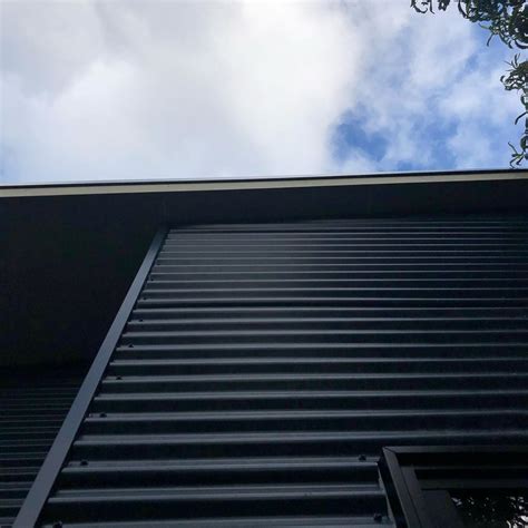 Colorbond Deep Ocean Cladding And Weathergroove Natural Timber Cladding