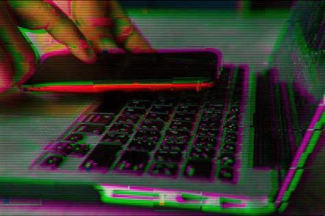 Hacker Using Computer And Phone For Analytsis Cyber Technology With