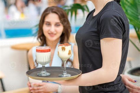 Waitress Carrying Tray With Desserts Stock Photo At Vecteezy