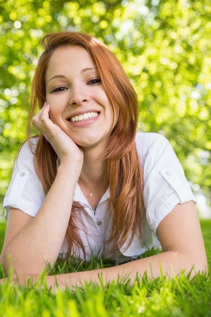 Premium Photo Pretty Redhead Relaxing In The Park