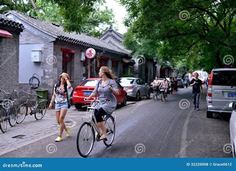 Foreign Girl Riding A Bicycle In Beijing S Hutongs Editorial Stock