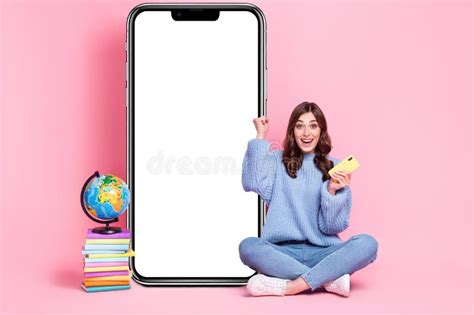 full size photo of excited delighted girl hold telephone raise fist