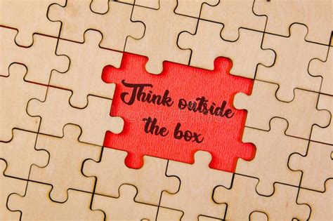 Puzzle Pieces With Word Think Outside The Box Business Concept Image