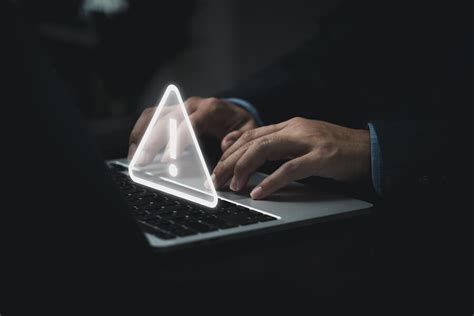 Premium Photo Businessman Programmer Developer Using Laptop Computer With Triangle Caution