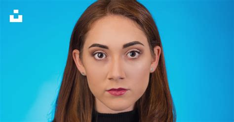 Woman Wearing Red Tank Top With Blue Background Photo Free Lighting