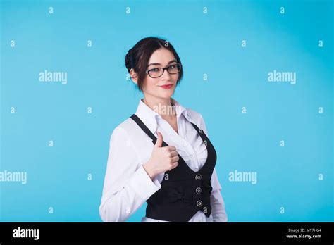 Happy Beautiful Girl In Stylish Black Glasses Showing Thumb Up Symbol