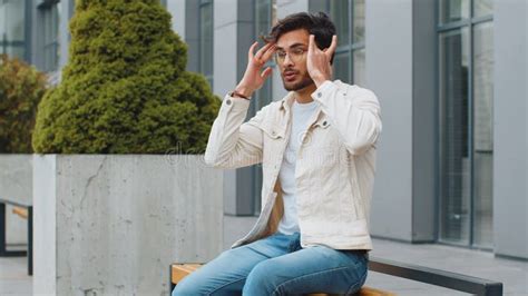 Displeased Sick Indian Man Rubbing Temples To Cure Headache Problem