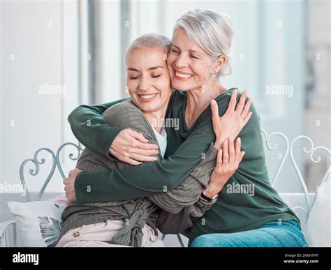 Cheerful Senior Mother Hugging Grownup Daughter Loving Caucasian Mom