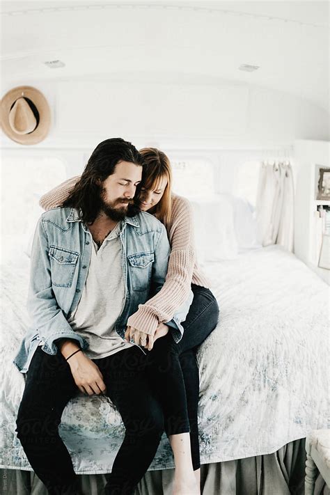 Cute Hipster Couple Cuddling In Converted Babe Bus Tiny Home By Stocksy Contributor Brett