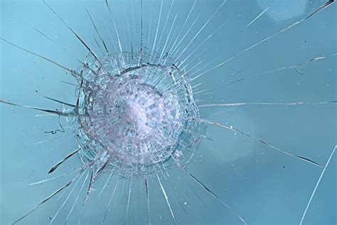 Premium Photo Cracks On The Glass Impact On The Glass Abstract