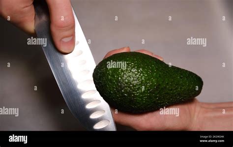 Male Hands Cut Avocado In Half Fresh Ripe Avocado Healthy Breakfast