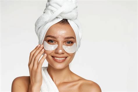 Premium Photo Skincare Cheerful Young Woman Smiling Applying Cosmetic