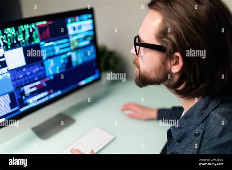 Software Developer On The Computer Screen And Is Analyzing The Code