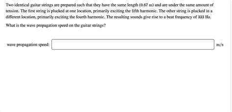 solved two identical guitar strings are prepared such that