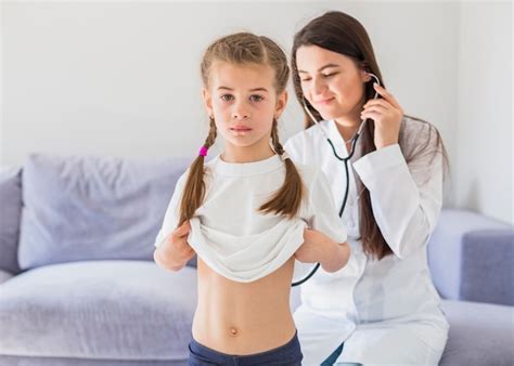 Free Photo Ill Girl Being Examined By The Doctor