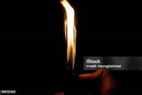 Close Up View Of Real Sparking Light From Lighter In Dark Black