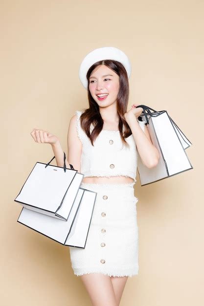 Premium Photo Cute Asian Woman Smile And Holding White Shopping Bags