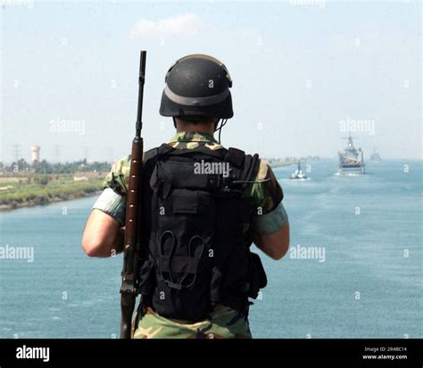 Us Navy Master At Arms 2nd Class Stands A Flight Deck Security Patrol