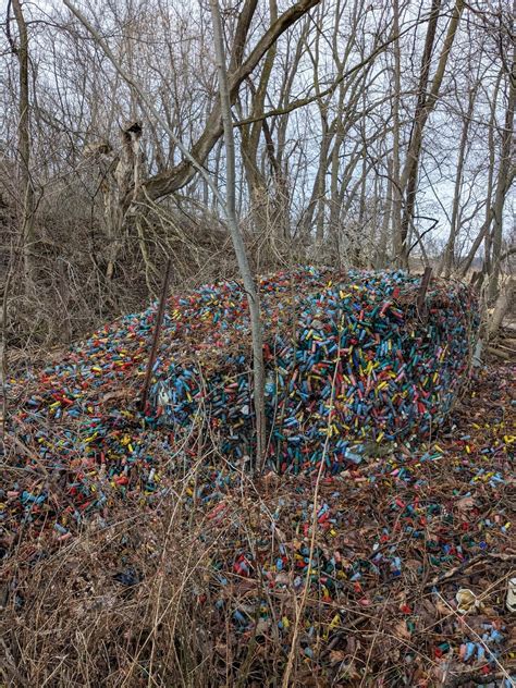 Massive Pile Of Empty Shotgun Shells Behind What Used To Be A Trap