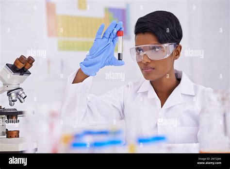 She Leaves No Room For Error A Beautiful Young Scientist Examining A