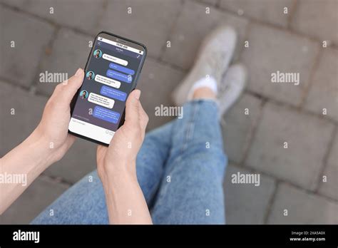 Woman Texting Via Mobile Phone Outdoors Closeup Device Screen With