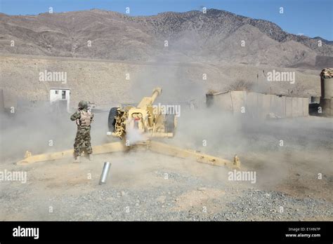 An Afghan National Army Soldier Fires A D30 122 Mm Howitzer During An