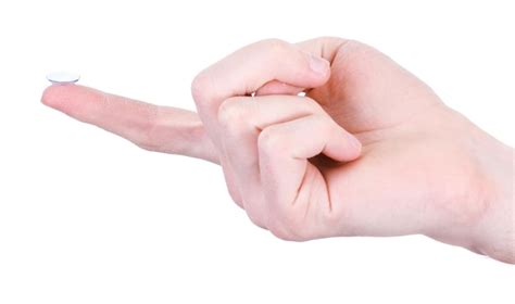 Premium Photo Contact Lens On Finger Isolated On White
