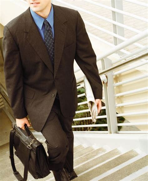 Businessman In Suit Ascending Stairs Outdoors Free Photo Download