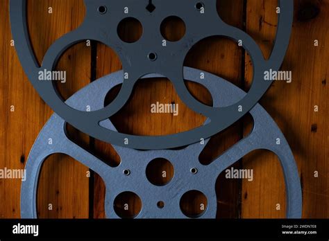 Two Movie Reels On A Pine Floor Intersecting Abstract Background Stock