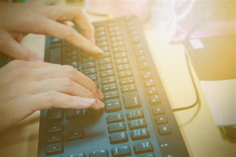 Premium Photo High Angle View Of Woman Typing On Keyboard