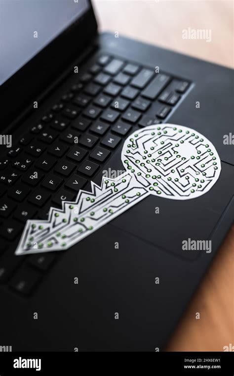 Encryption Key Icon Made Of Circuits And Led Lights On Top Of Laptop