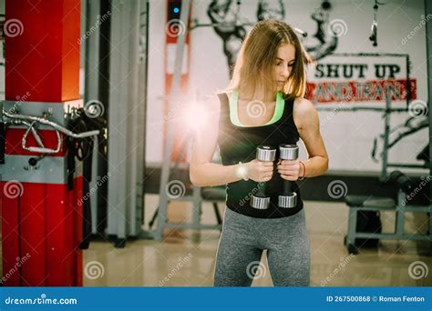 Athletic Bodybuilder Woman With Dumbbellsbeautiful Blonde Girl With