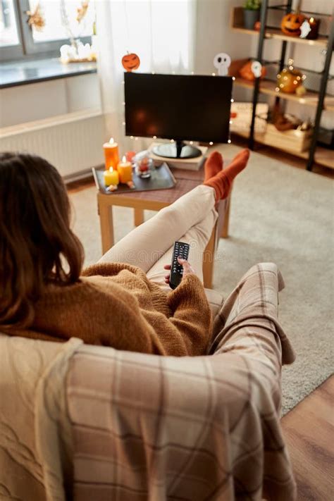 Young Woman Watching Tv At Home On Halloween Stock Image Image Of