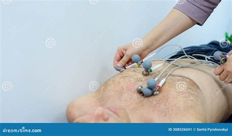 Clinic Hospital Monitors Health Nurse Preparing Male Patient For Ecg