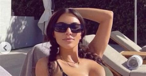 Kim Kardashian Flaunts Cleavage In Tiny String Bikini As Ex Kanye Cuts