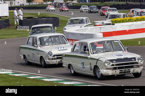 April Lotus Cortina Mk Racing Together At The Goodwood Members Meeting Stock Photo