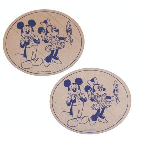 A Pair Of Mickey And Minnie Fabric Stickers