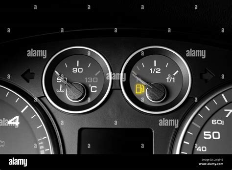 Glowing Fuel Gauge On Dashboard Stock Photo Alamy
