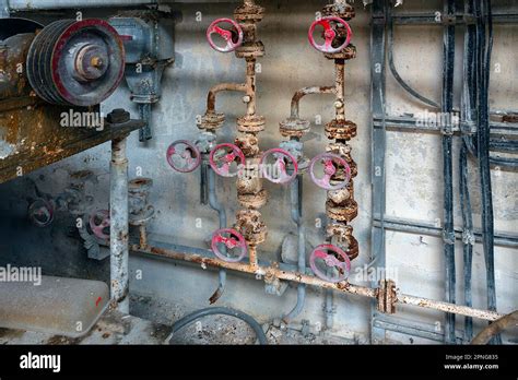 rusty taps on water pipes of a former paper factory lost place