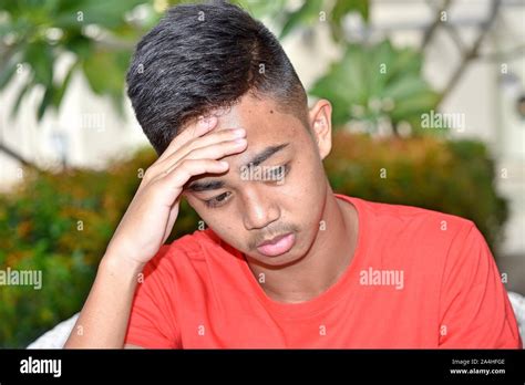 Stressed Youthful Asian Boy Stock Photo Alamy