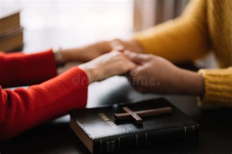 Asian Men And Women Hands Praying To God With The Bible Pray For God