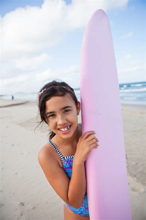 Surfer Girls Group Holding Happy Surfboards On Convertible Car Stock