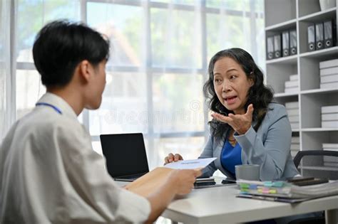 A Male Employee Is Having A Serious Talk And Giving A Resignation