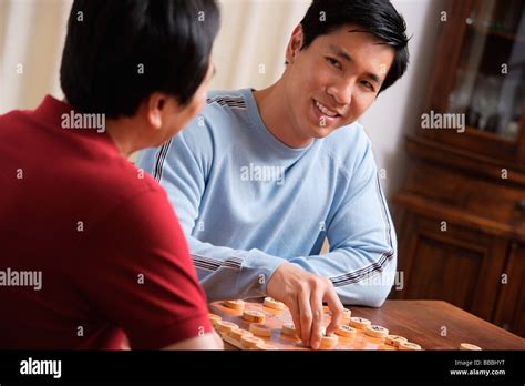 Father And Son Playing Board Game Stock Photo Alamy