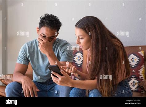 Infidelity Jealous Girlfriend Showing His Cheating Boyfriend His Phone Demanding Explanation