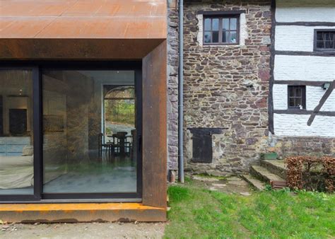 Puzzles Architecture Adds Rusted Steel Extension To Belgian Barn