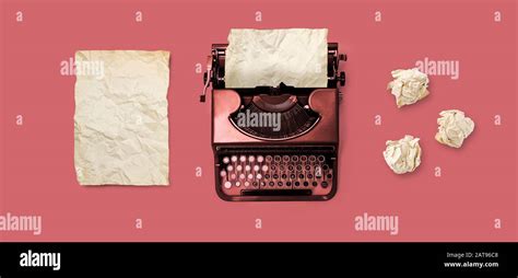 Vintage Typewriter And Crumpled Papers Over Colour Background With Copy