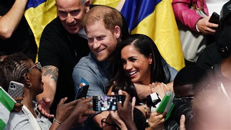 Meghan Markle And Prince Harry Enjoy Intimate Hug And Pose For Selfies